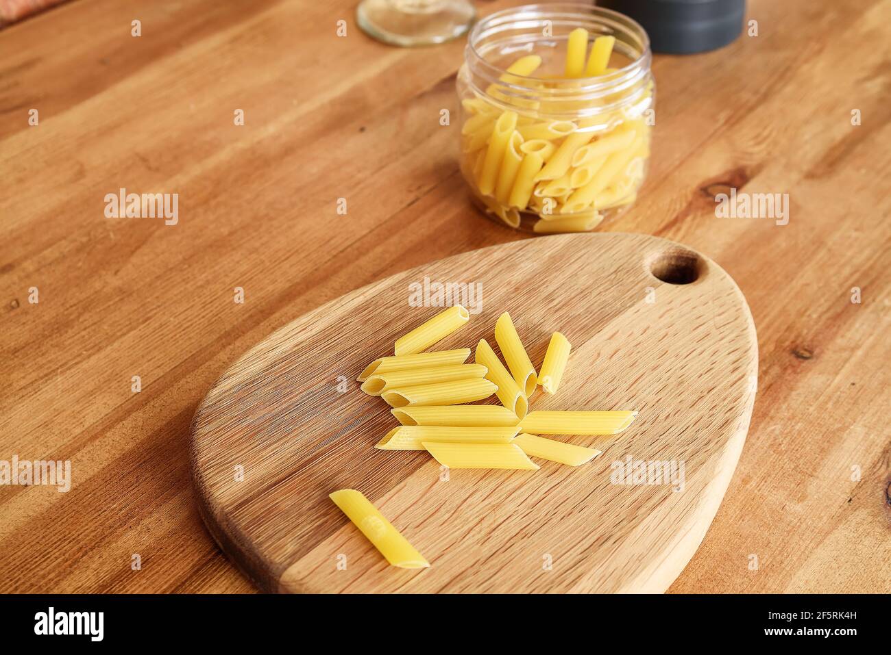 Top view of pasta, raw spilled Italian pasta view from above on neutral ...