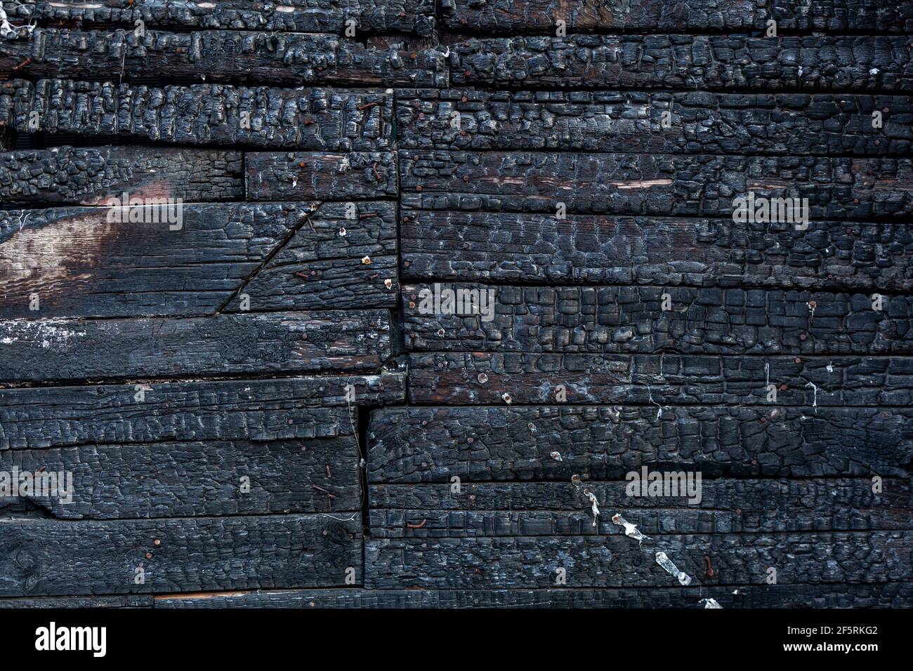 Burned wooden plank background. Details of surface of charred wood ...