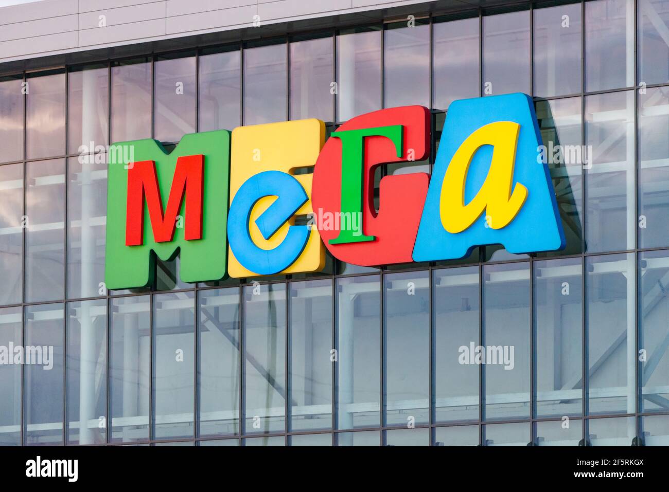 Mega name of the retail chain. The emblem on the glass facade Stock ...