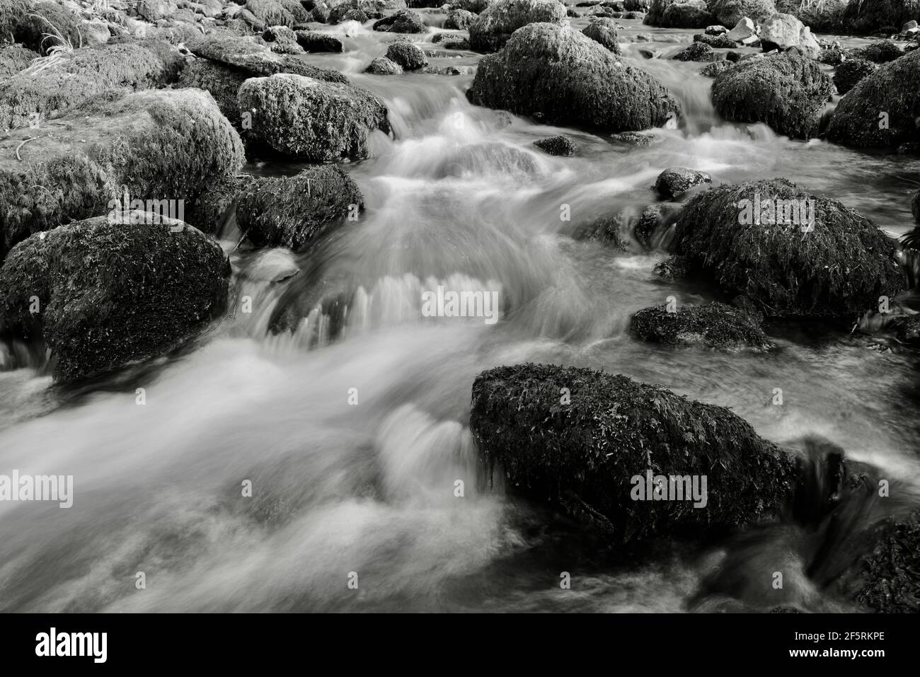 Fast flowing river white water rocks valley mountains hi-res stock ...