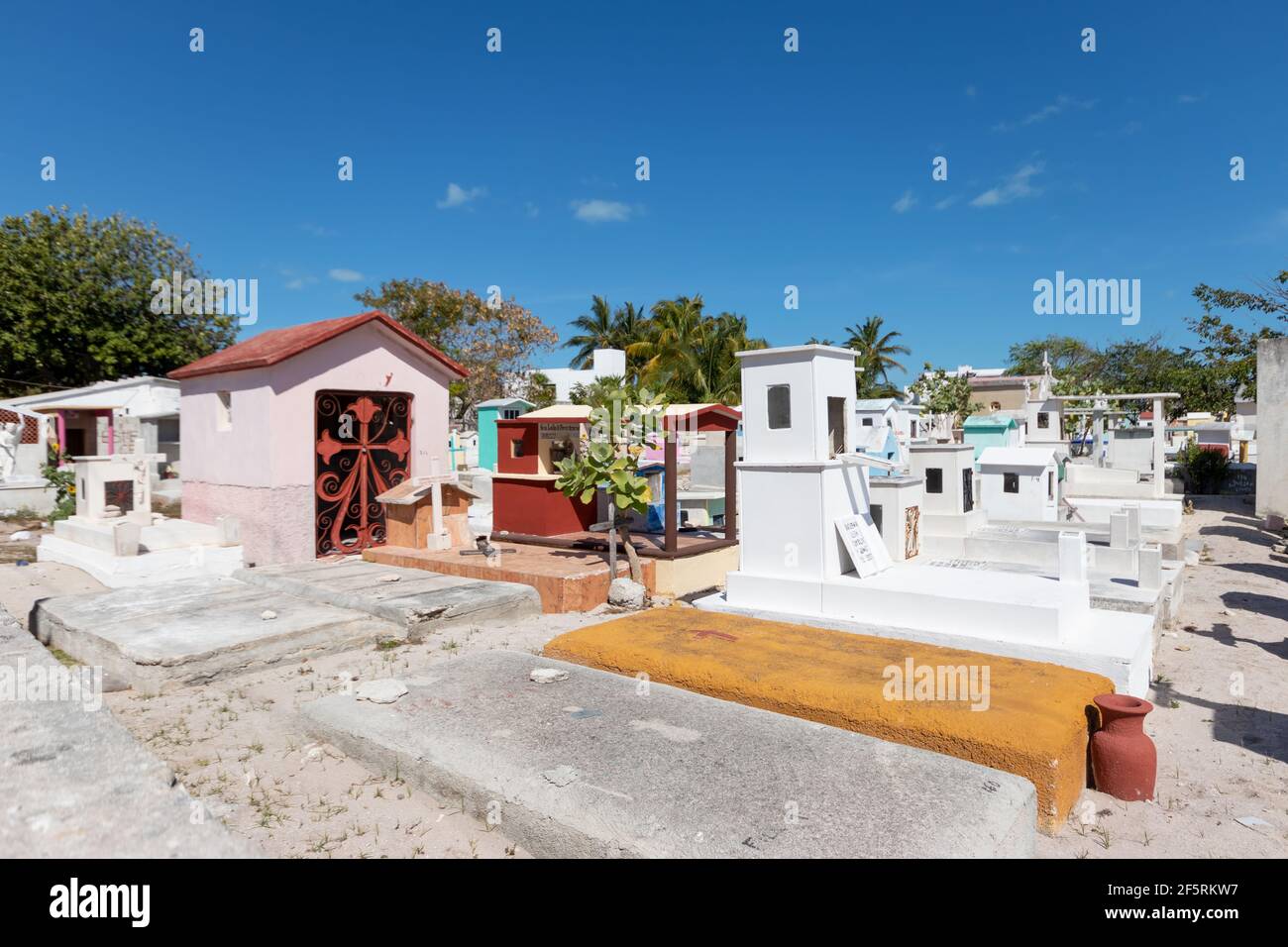 Colourful and elaborate monuments in a Mexican cemetery. People of ...