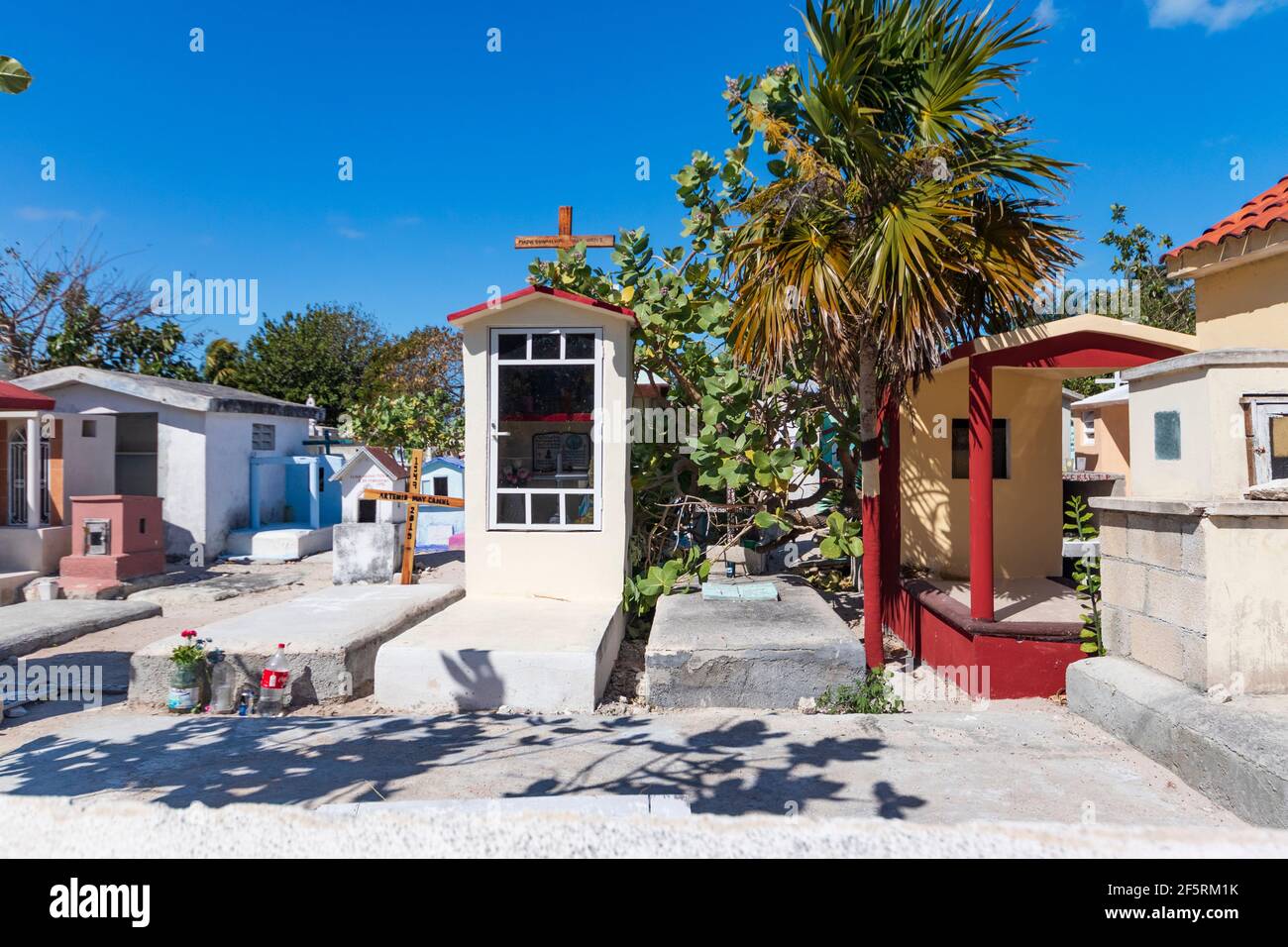 Colourful and elaborate monuments in a Mexican cemetery. People of ...
