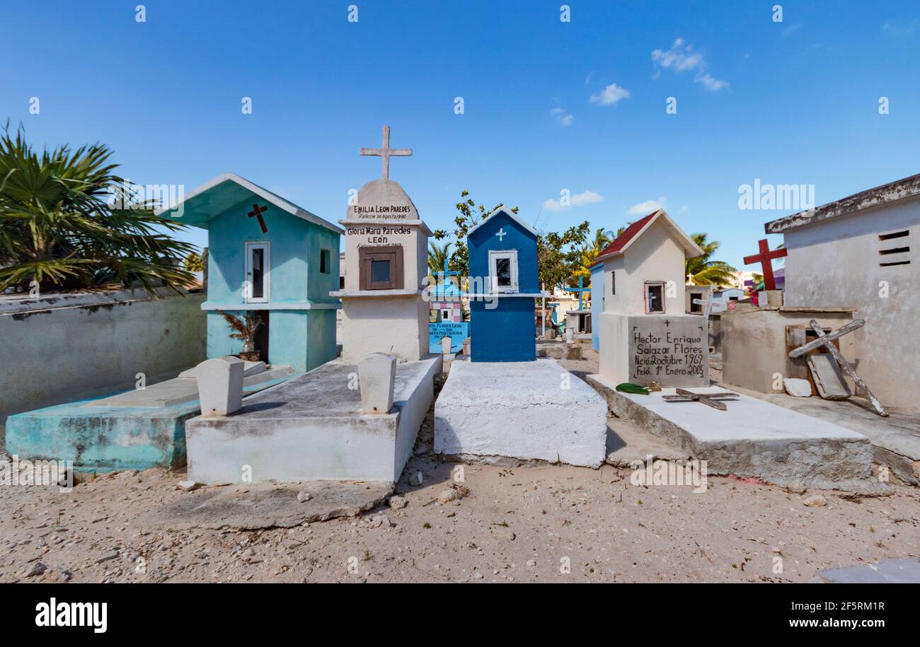 Colourful and elaborate monuments in a Mexican cemetery. People of ...