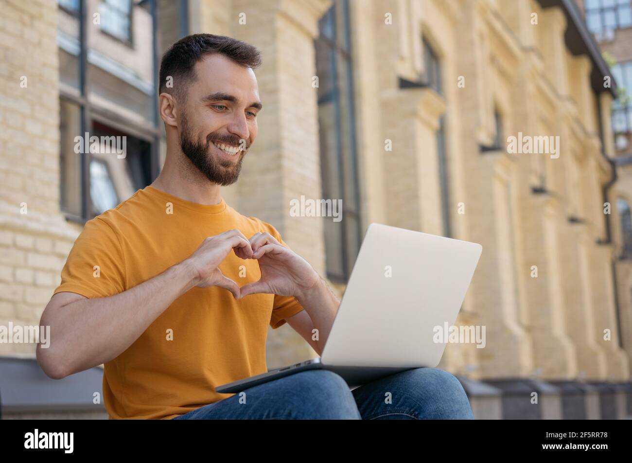 Successful influencer using laptop computer communication online with ...