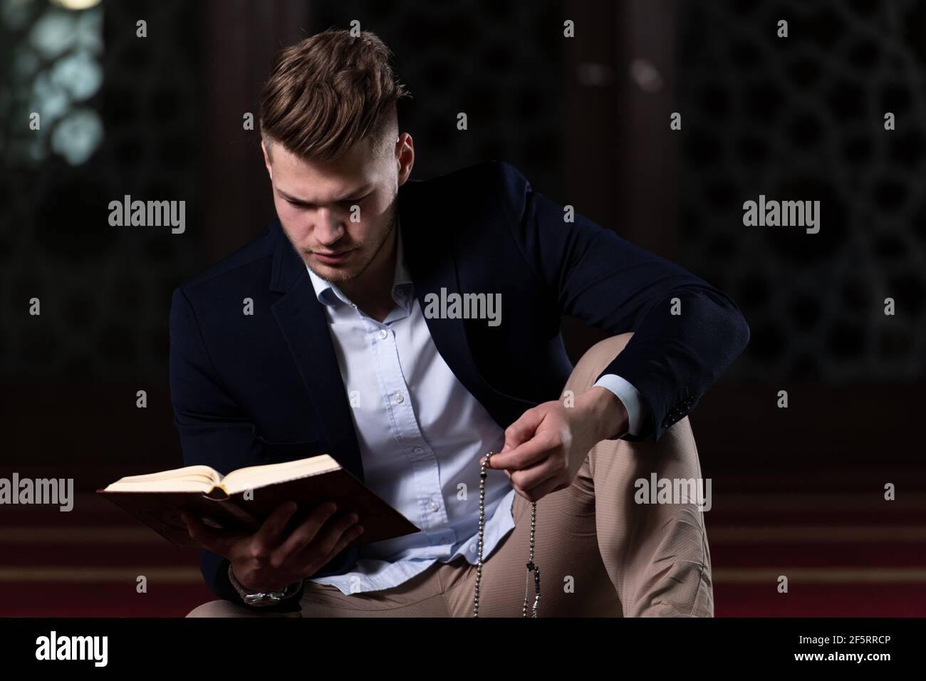 Attractive Man Making Traditional Prayer to God Allah in the Mosque ...