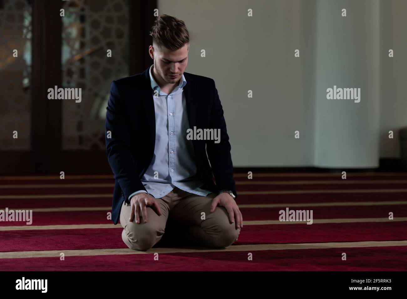 Attractive Man Making Traditional Prayer to God Allah in the Mosque ...