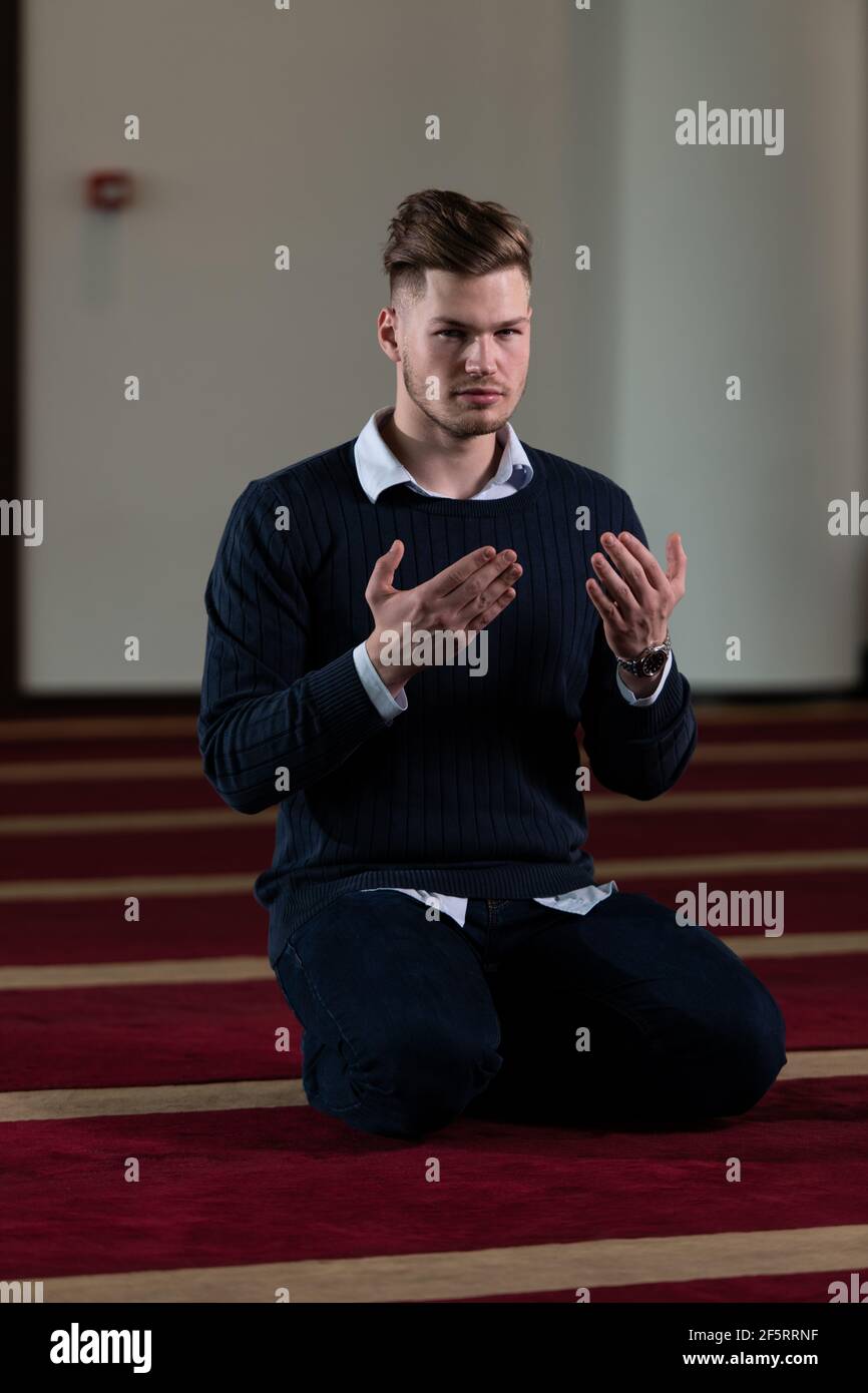 Attractive Man Making Traditional Prayer to God Allah in the Mosque ...