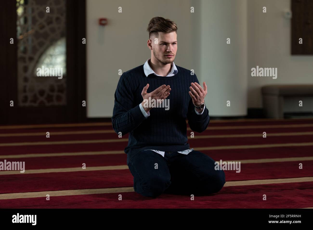 Attractive Man Making Traditional Prayer to God Allah in the Mosque ...