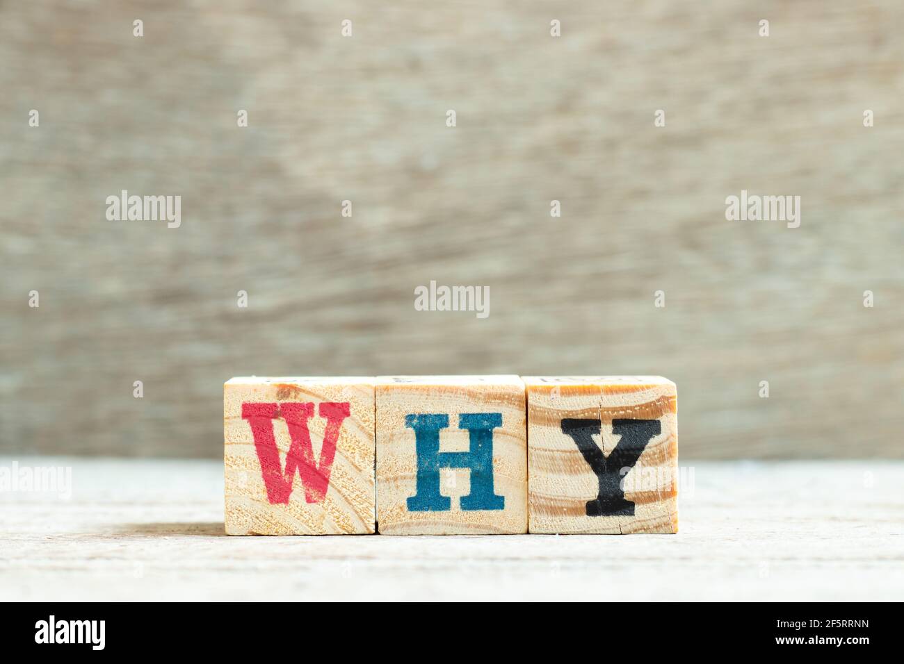 Alphabet letter block in word why on wood background Stock Photo - Alamy