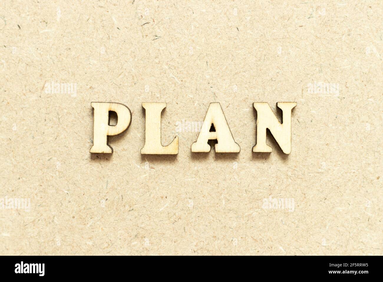 Alphabet letter in word plan on wood background Stock Photo - Alamy