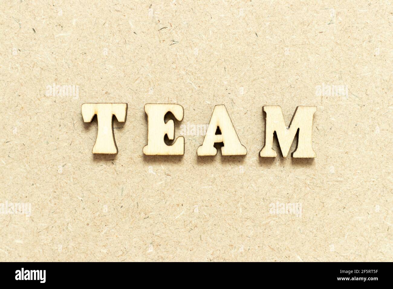 Alphabet letter in word team on wood background Stock Photo - Alamy