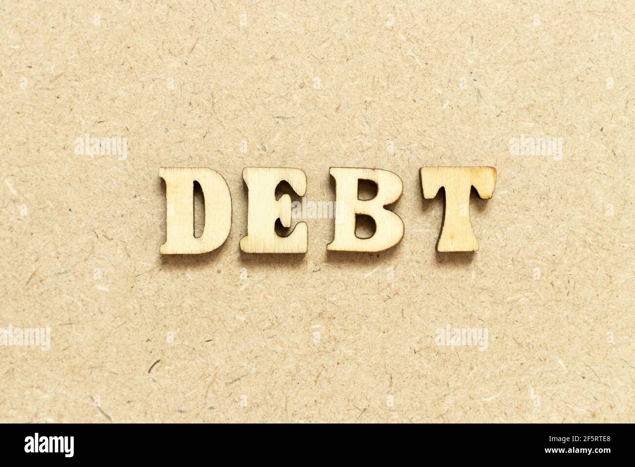 Alphabet letter in word debt on wood background Stock Photo - Alamy