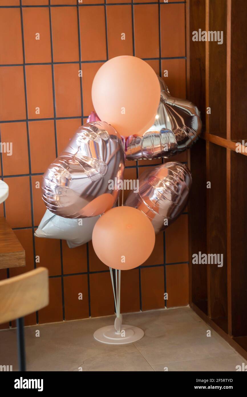 Metallic silver helium balloon heart hi-res stock photography and ...