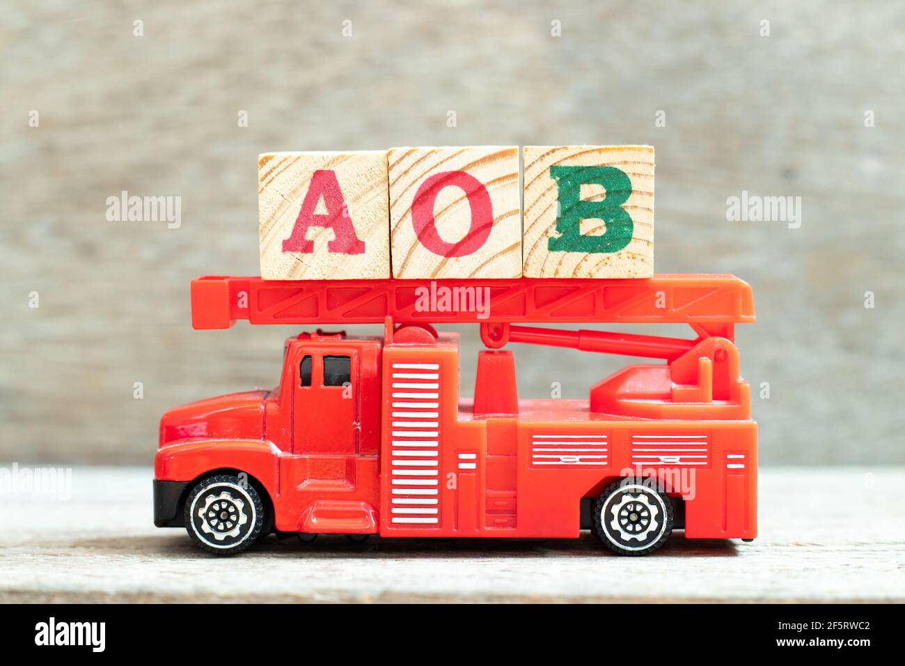 Fire ladder truck hold letter block in word AOB (abbreviation of ...