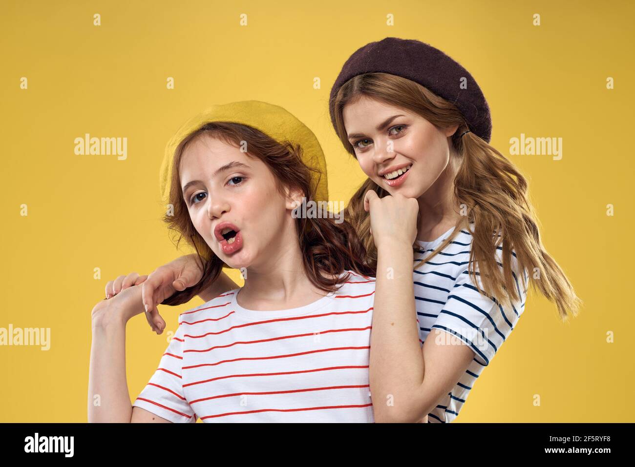 funny mom and daughter wearing hats fashion fun joy family yellow ...