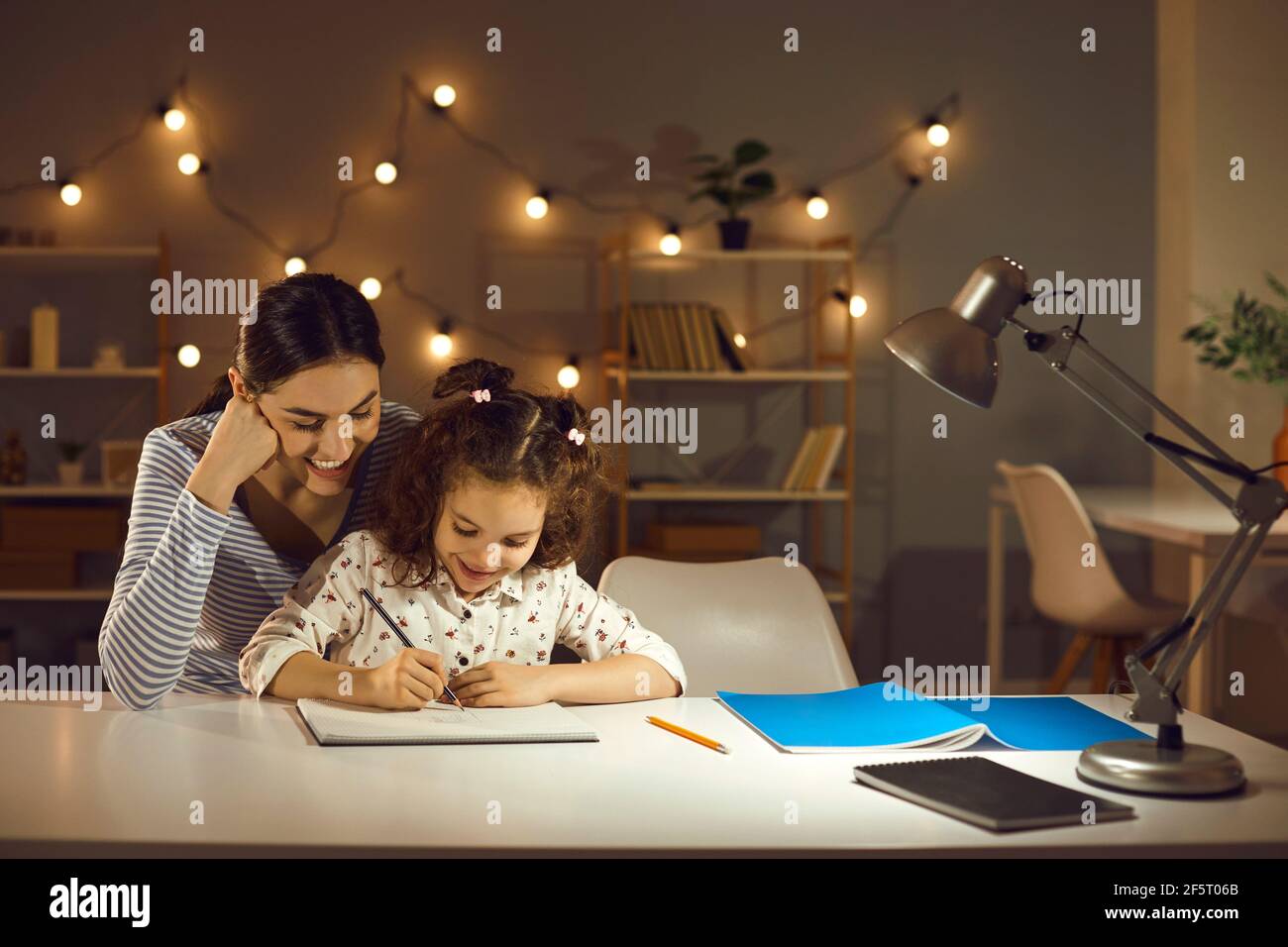 Homework child happy mother hi-res stock photography and images - Alamy