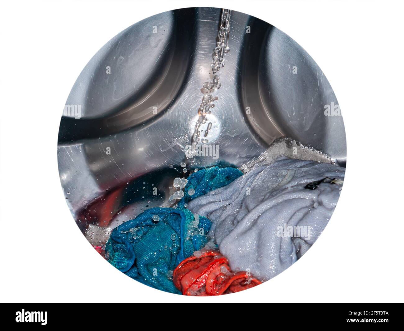 Rotating drum in a washing machine tub with clothes. Washer. Automatic ...