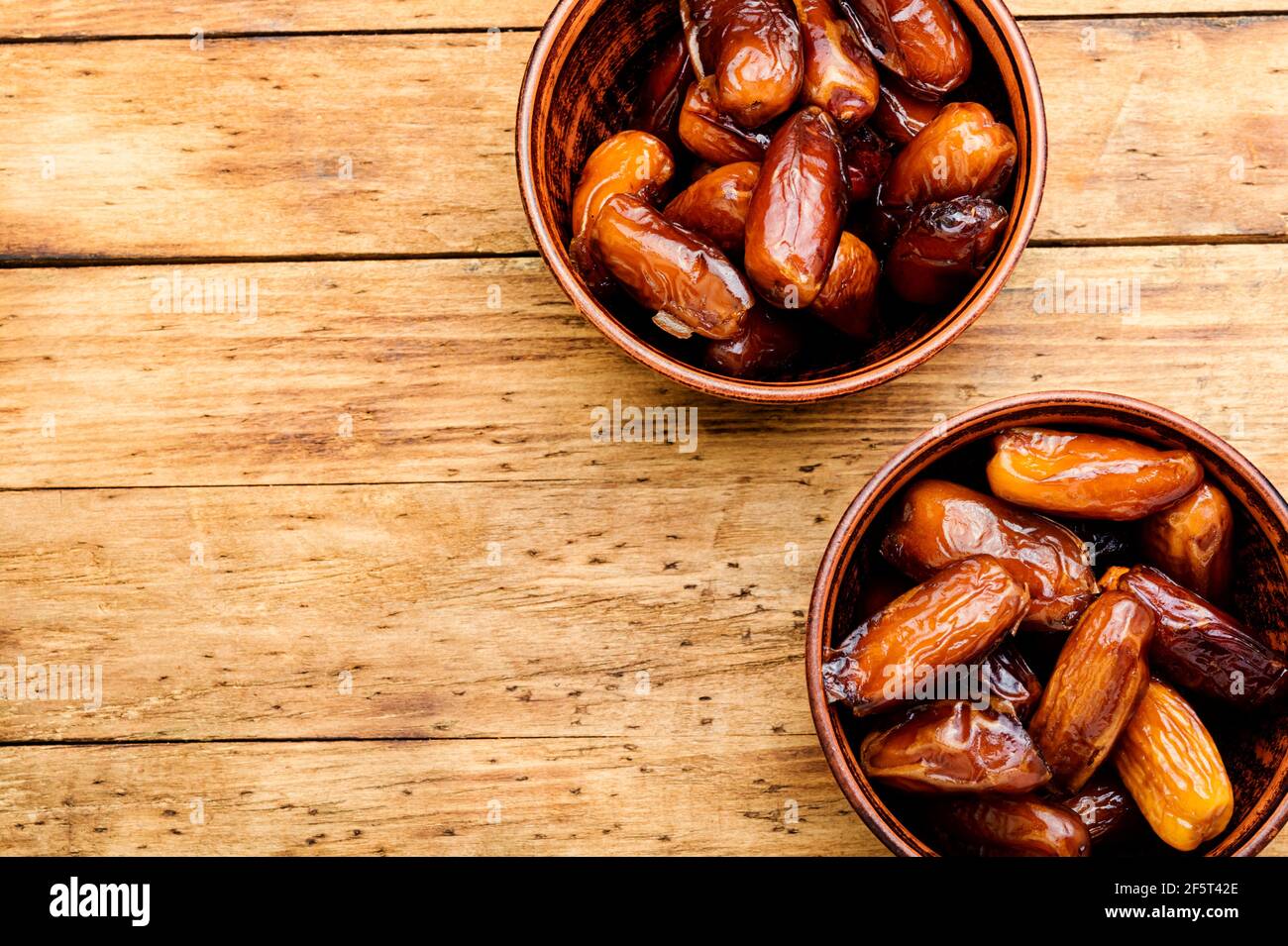 Dried date fruit in bowl.Traditional oriental sweets Stock Photo - Alamy