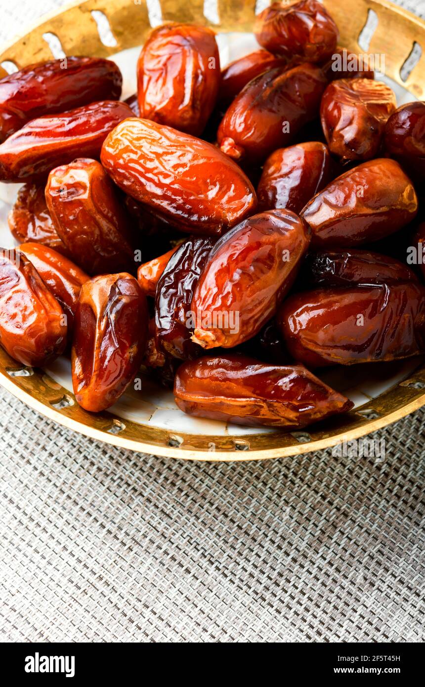 Dried date fruit in bowl.Traditional oriental sweets Stock Photo - Alamy
