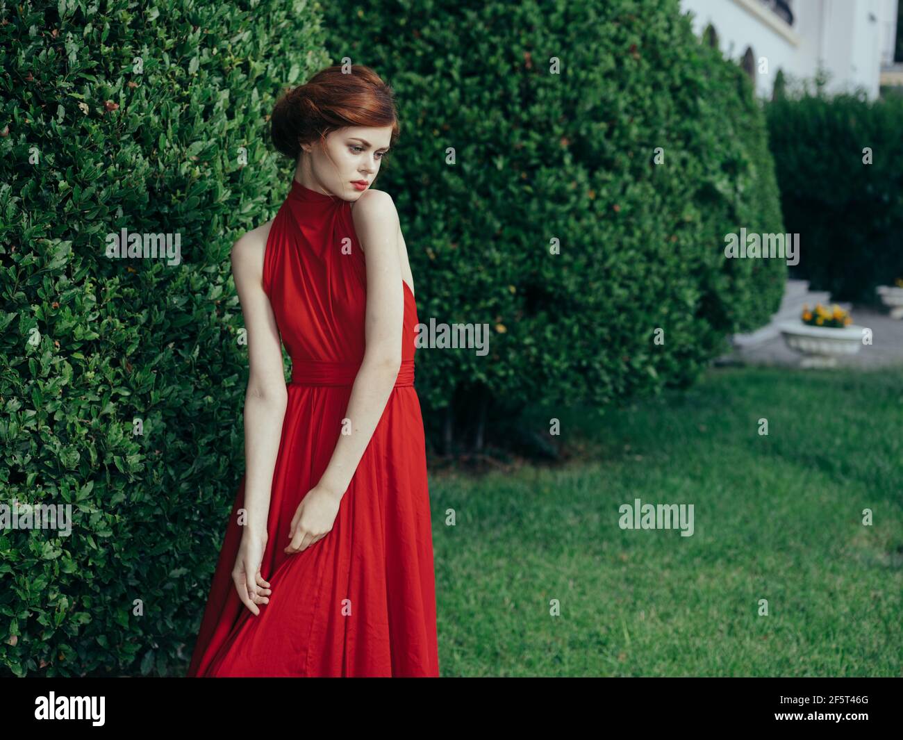 Pretty woman red dress Masquerade walk gothic style Stock Photo - Alamy