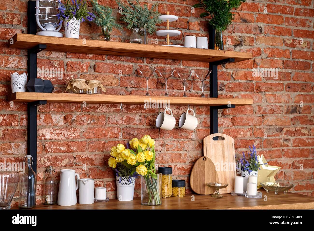 Contemporary kitchen background with kitchen utensils standing on ...