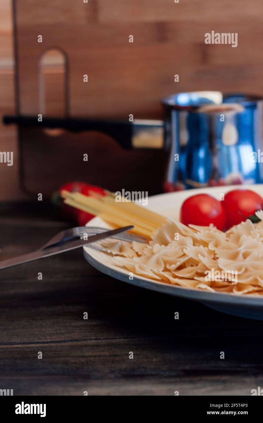 pasta plates italian cuisine cooking wood table Stock Photo - Alamy