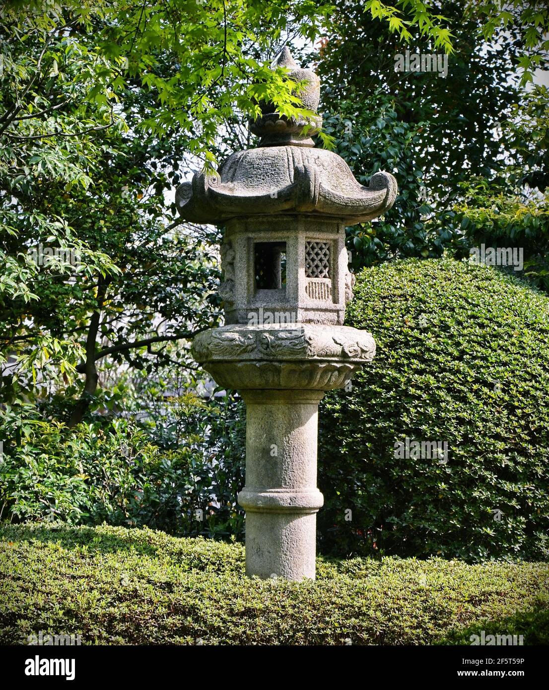 Japanese stone lantern at Shofuen garden, Fukuoka city, Japan. A tōrō ...