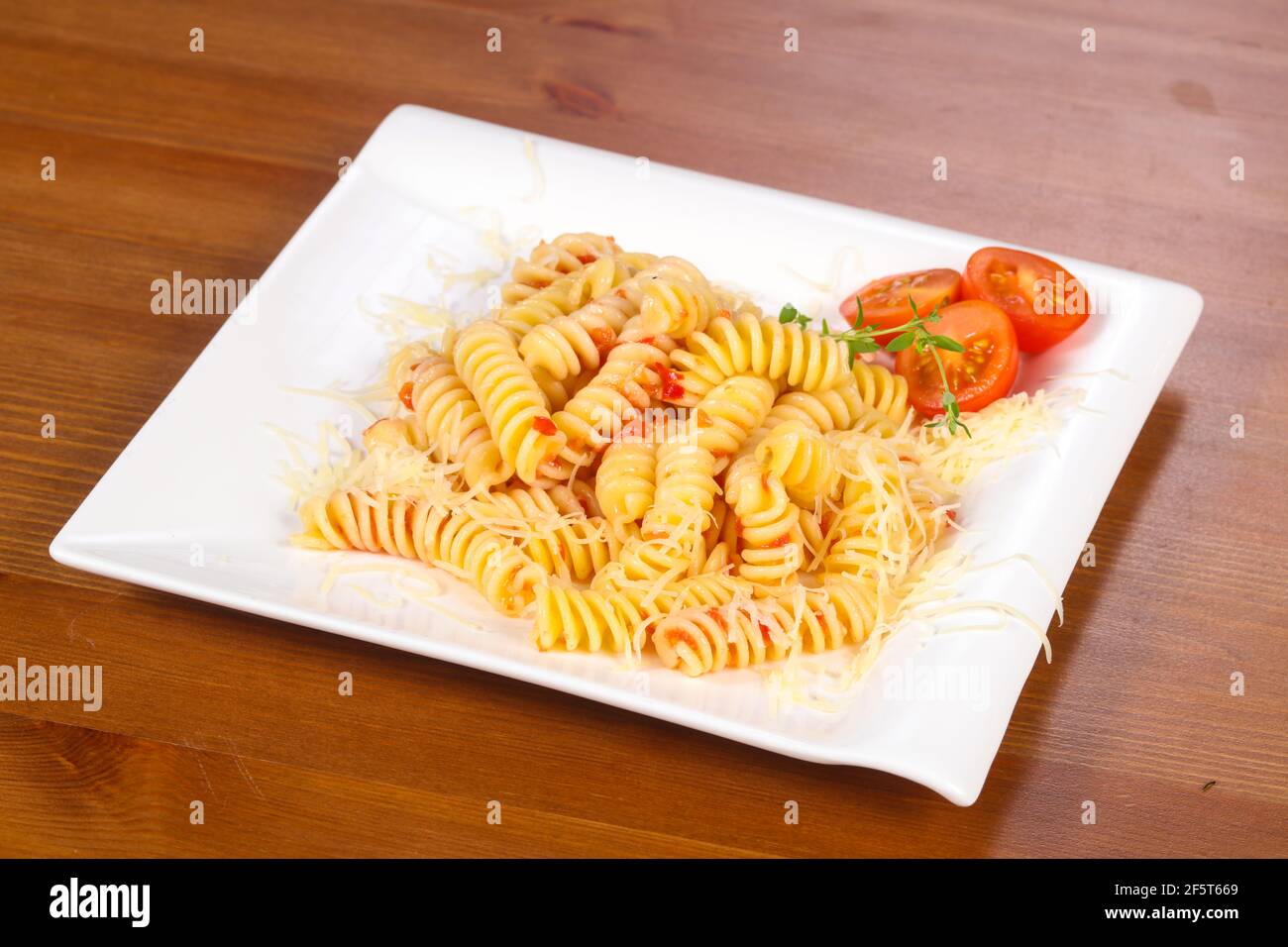 Italian springs pasta with tomato sauce and cheese Stock Photo - Alamy