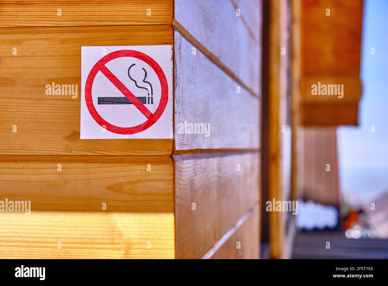 No smoking sign on the wall of a wooden house Stock Photo - Alamy