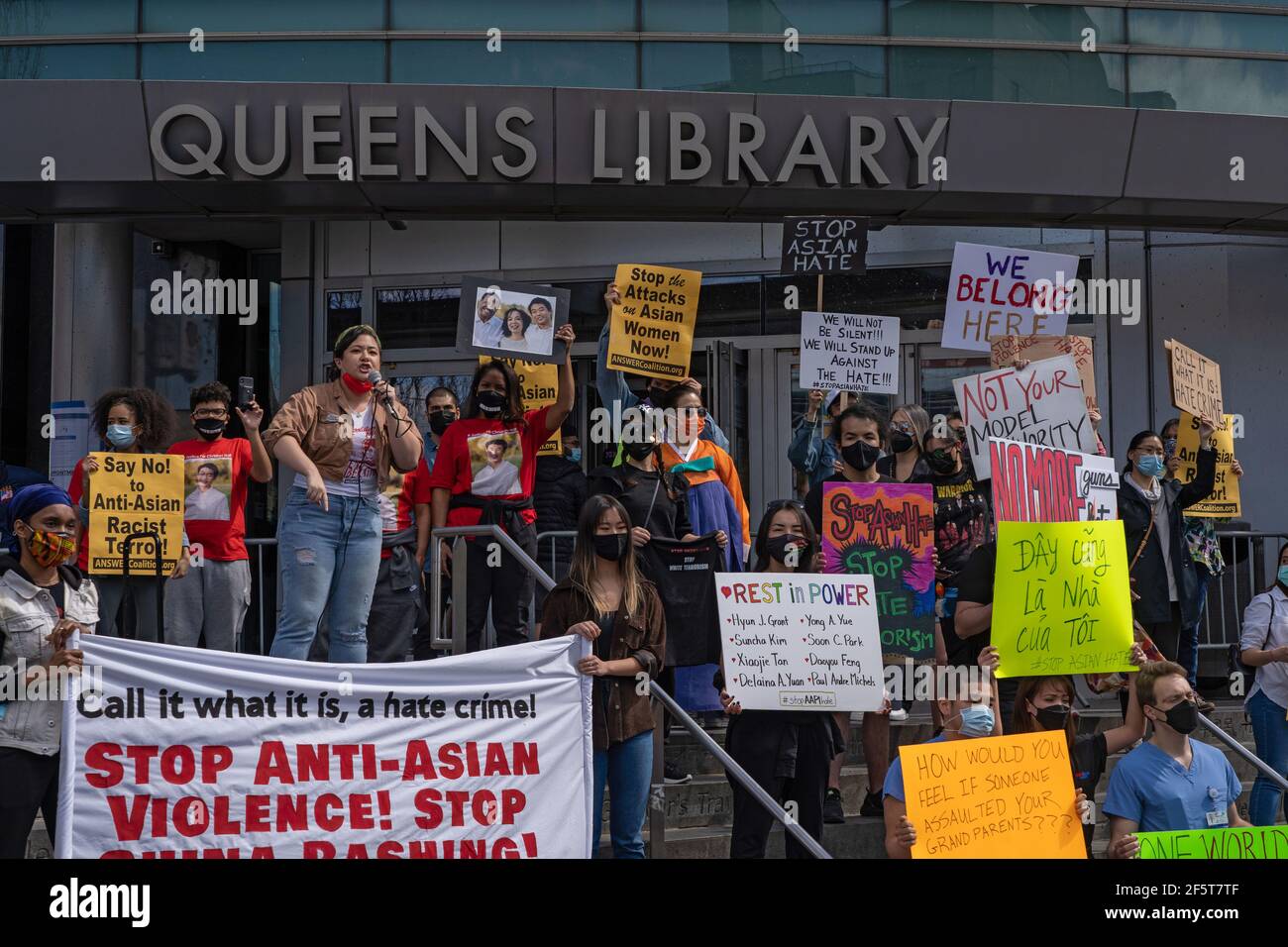 NEW YORK, NY - MARCH 27: Activist talks on the steps of the Queens ...