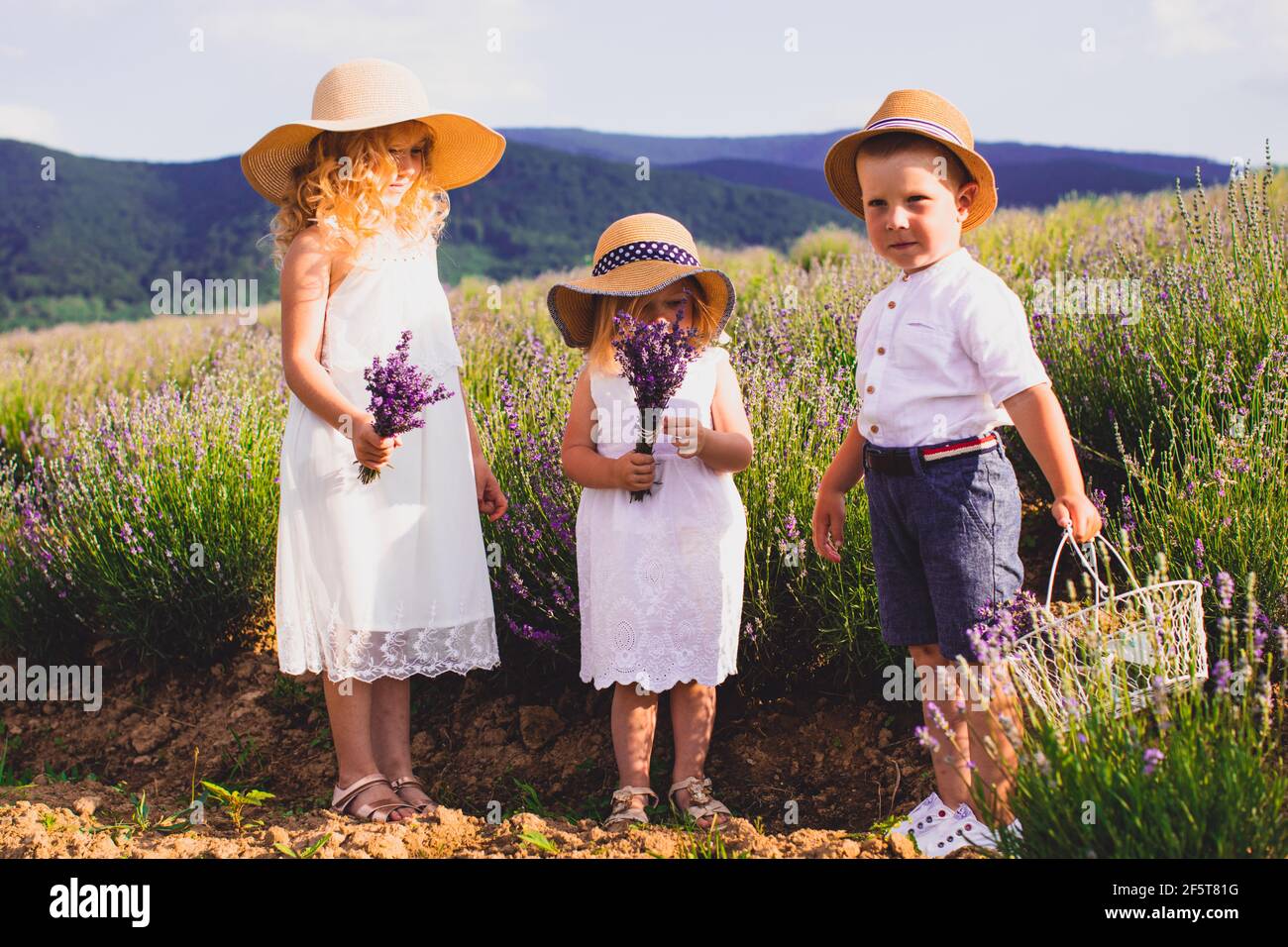 Three adorable kids, brother and two sisters Stock Photo - Alamy