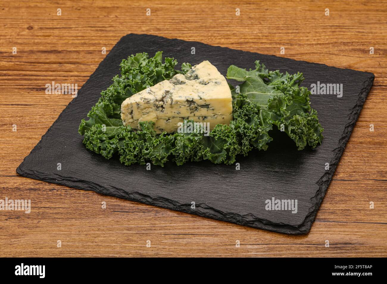 Dairy Blue cheese triangle with mold Stock Photo - Alamy