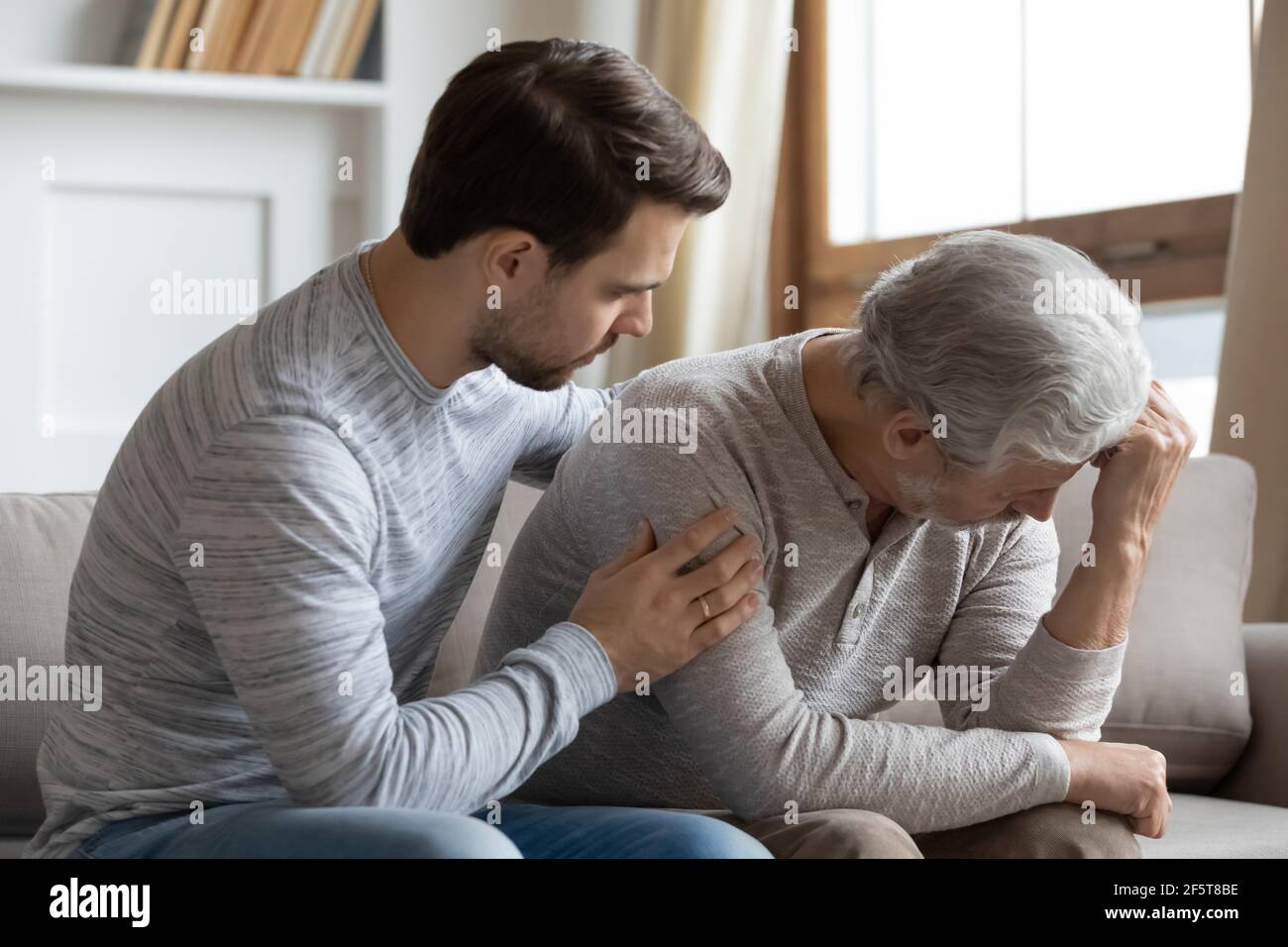 Adult son dad sad hi-res stock photography and images - Alamy