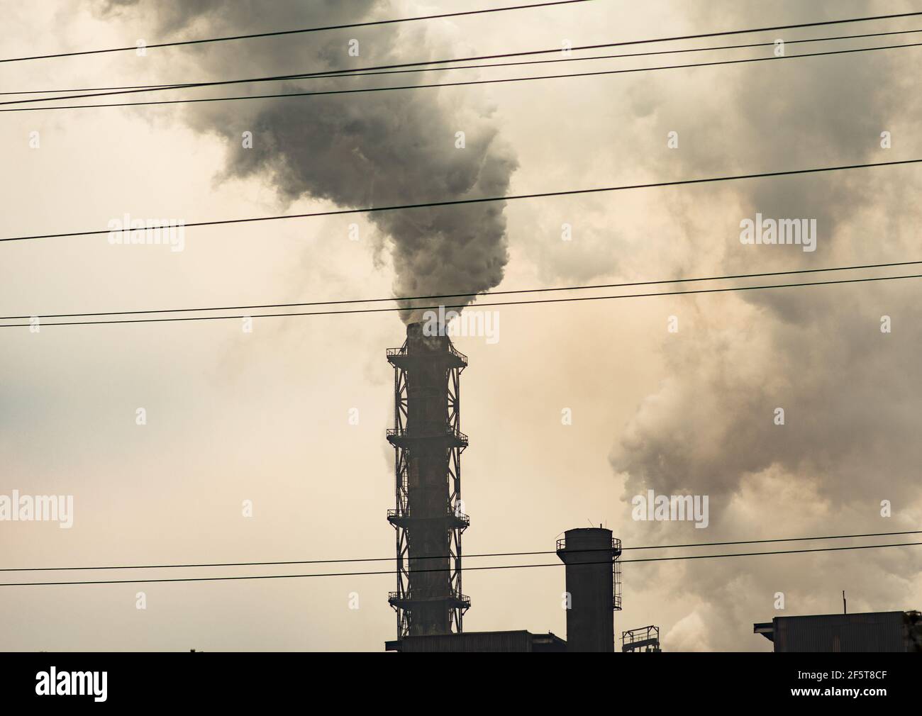 Smoking chimneys. the pollution of nature and a disbalance of ecology ...