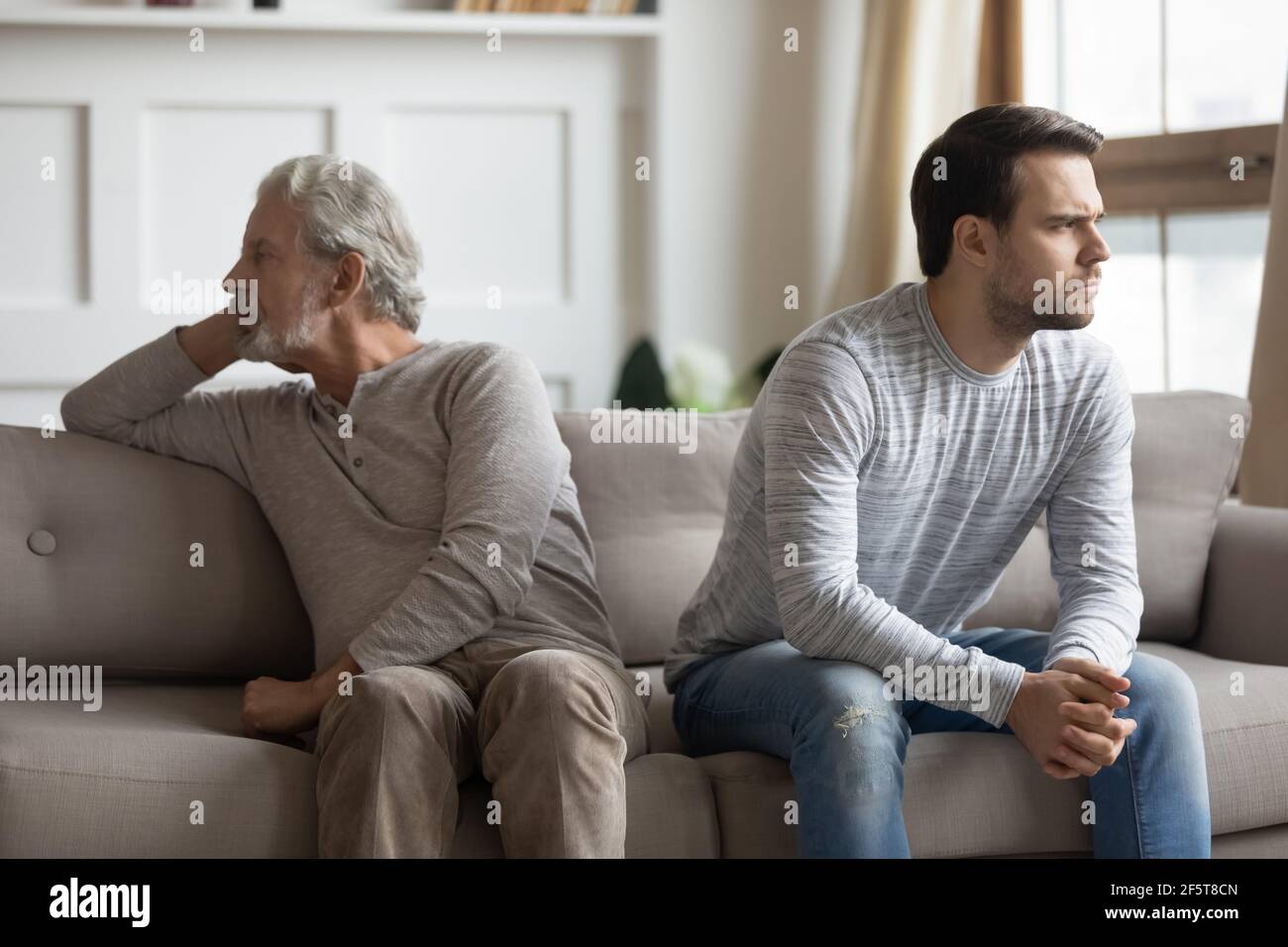 Angry adult son and mature dad have family fight Stock Photo - Alamy