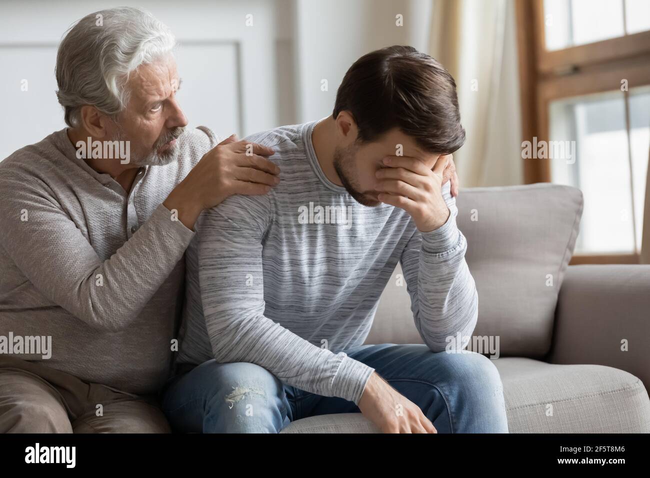 Adult son dad sad hi-res stock photography and images - Alamy