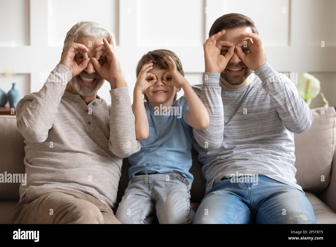 Portrait of three generations of men have fun Stock Photo - Alamy