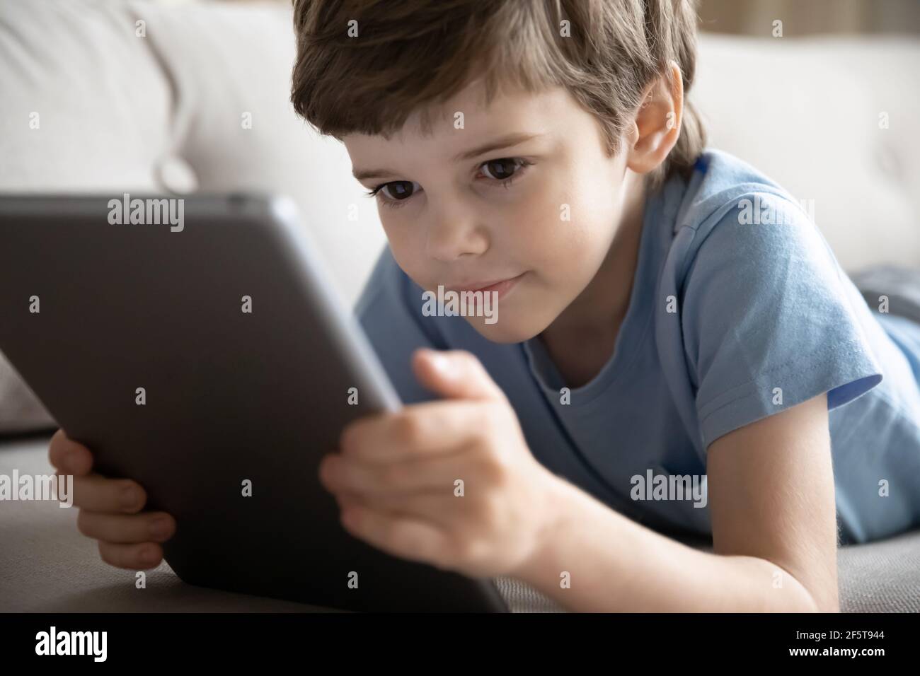 Child watching virtual screen hi-res stock photography and images - Alamy