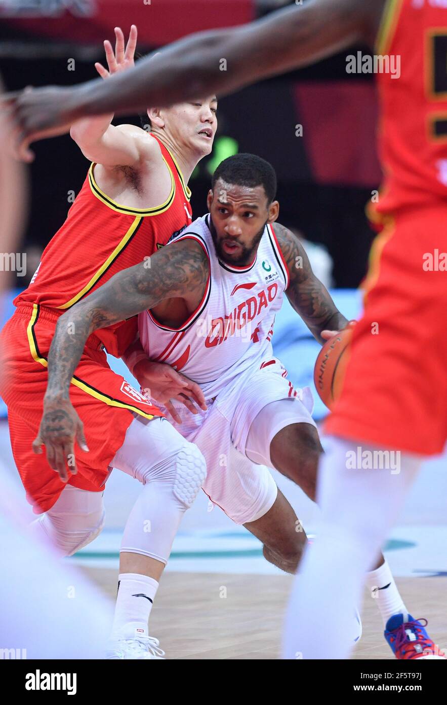 Zhuji, China's Zhejiang Province. 28th Mar, 2021. Darius Adams (R) of ...