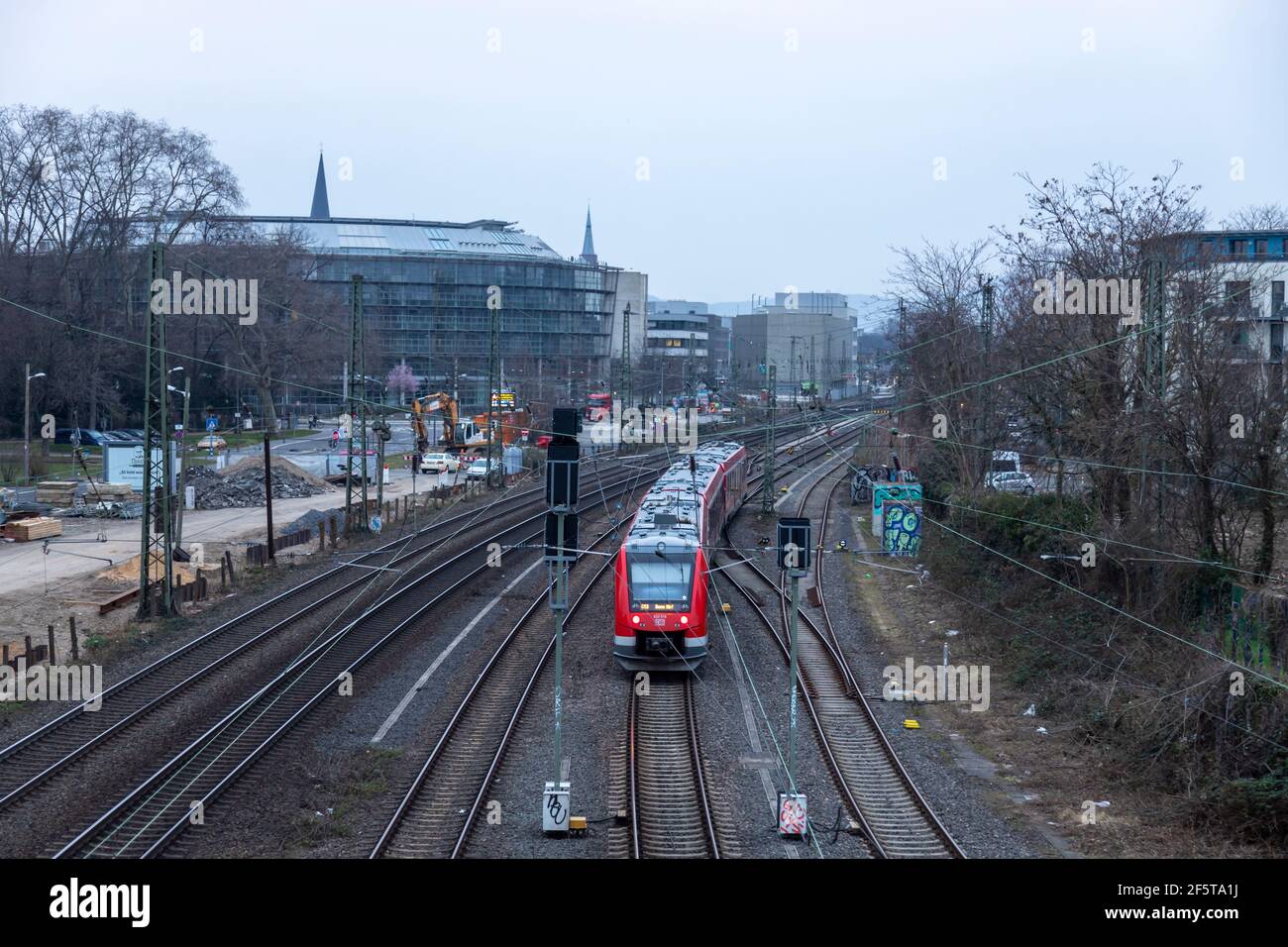 Bonn, NRW, Germany, 03 23 2021, red train driving to Bonn main station ...