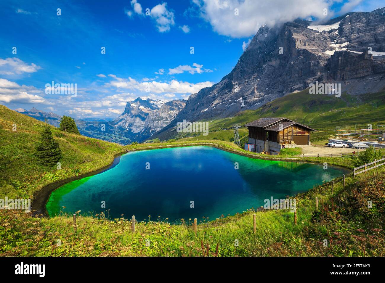 Picturesque small alpine lake in Kleine Scheidegg mountain resort and ...