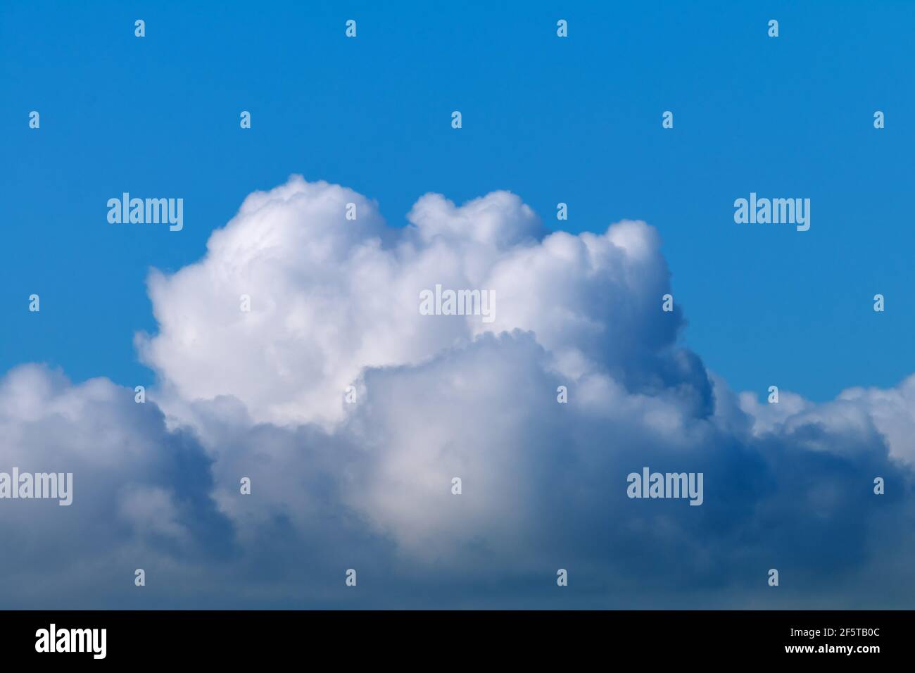 Clouds against a blue sky Stock Photo - Alamy