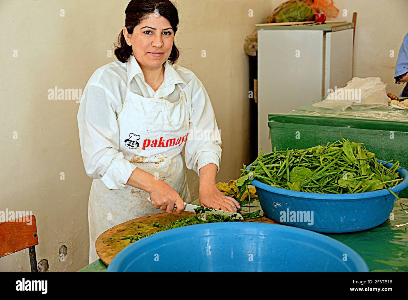Preparation of qutab, an Azerbaijani dish made from thinly rolled pasta ...