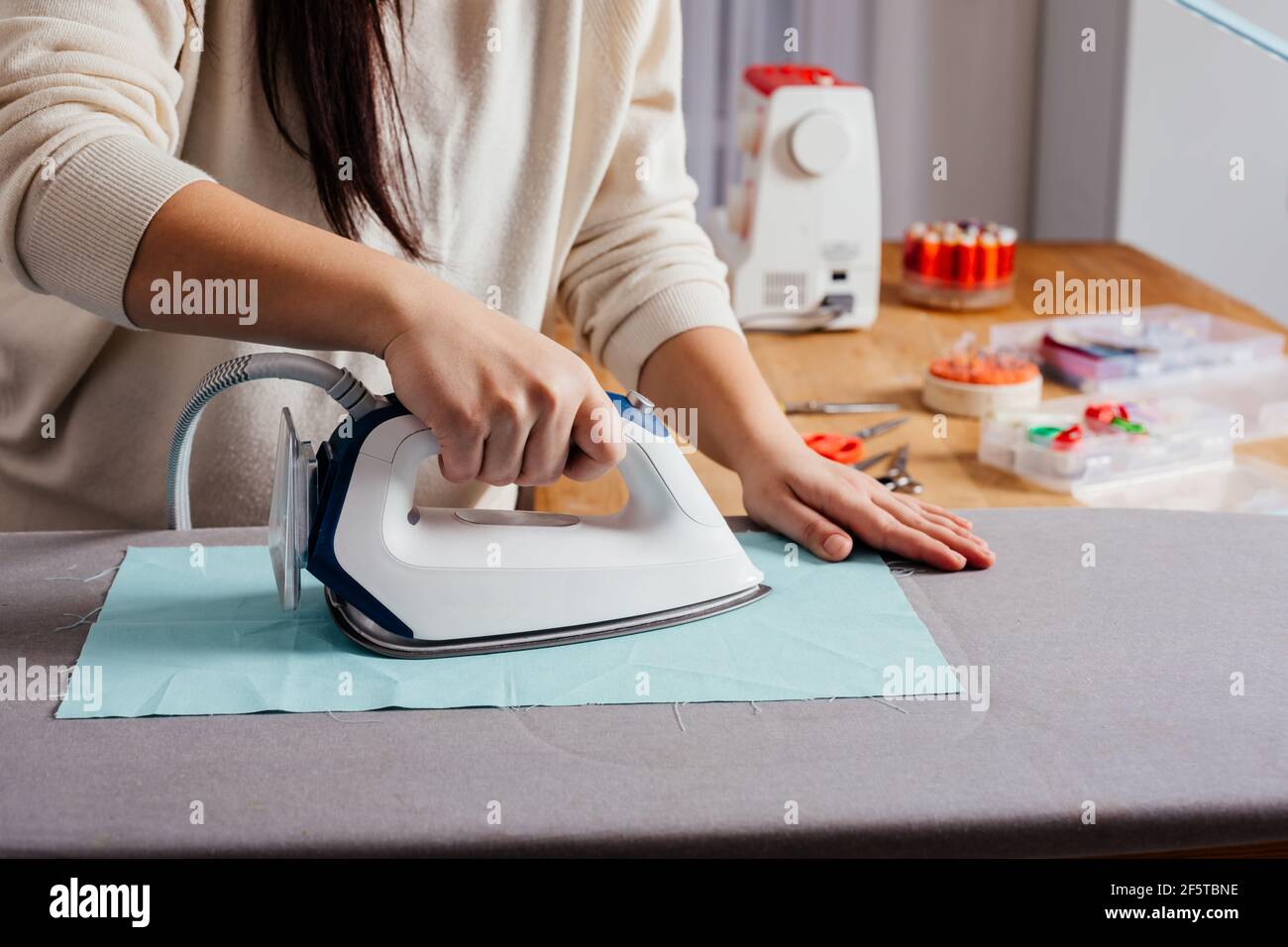 Process of ironing textile before cutting the pattern and sewing Stock ...