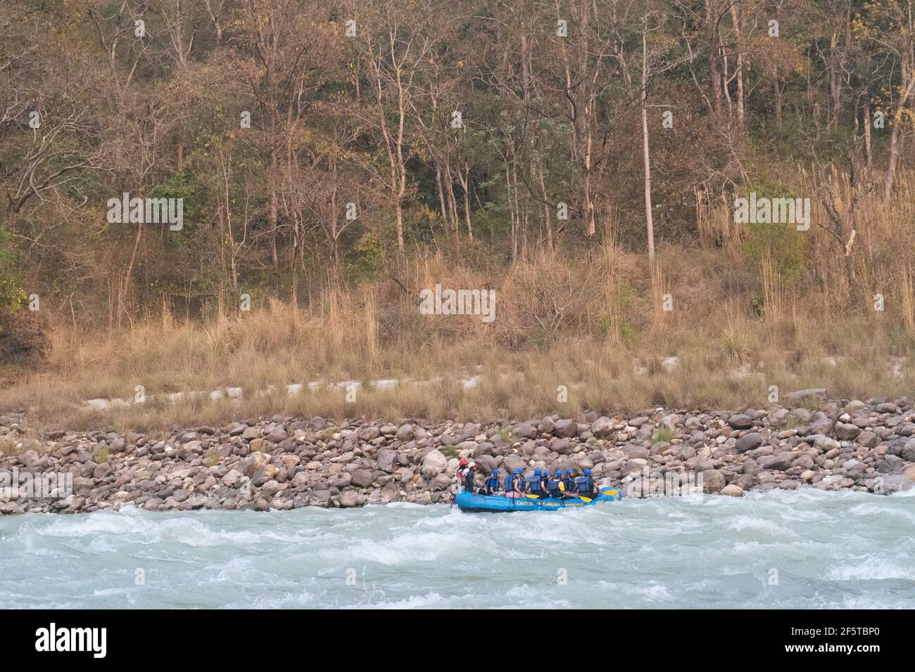 While rafting the river in Rishikesh, the rafting boat is moving at its ...