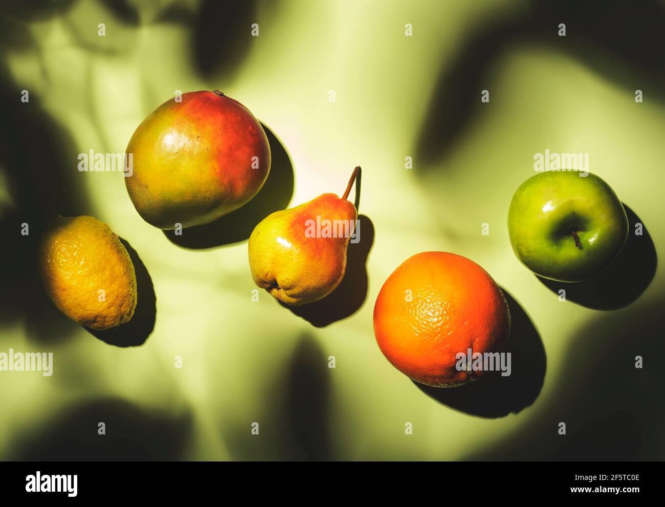 Summer fruits top view. Contemporary still life, lime green background ...