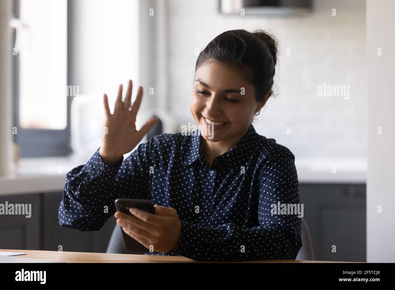 Close up smiling Indian woman waving hand, making video call Stock ...