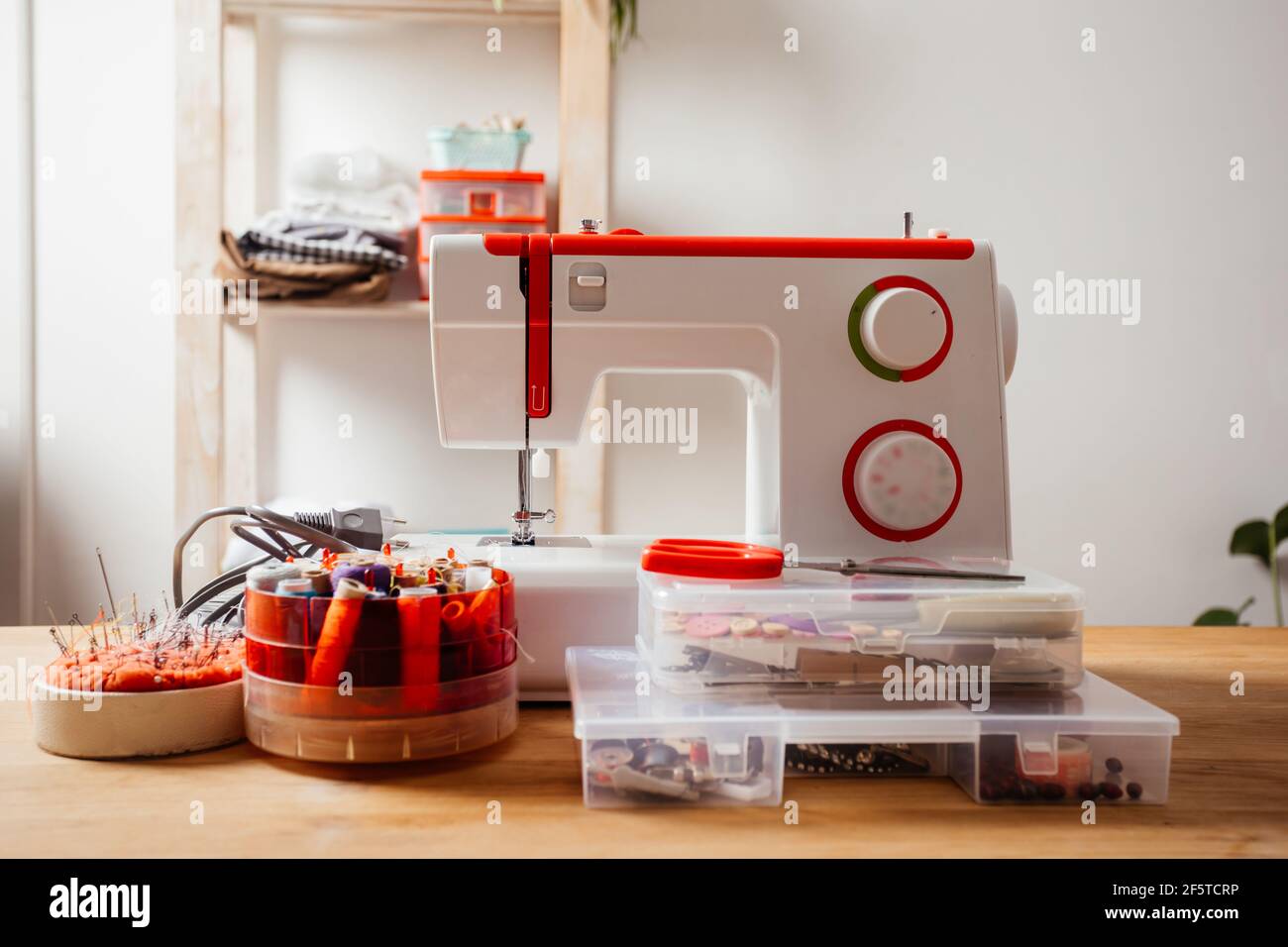 Modern sewing machine with variety of threads in box Stock Photo - Alamy