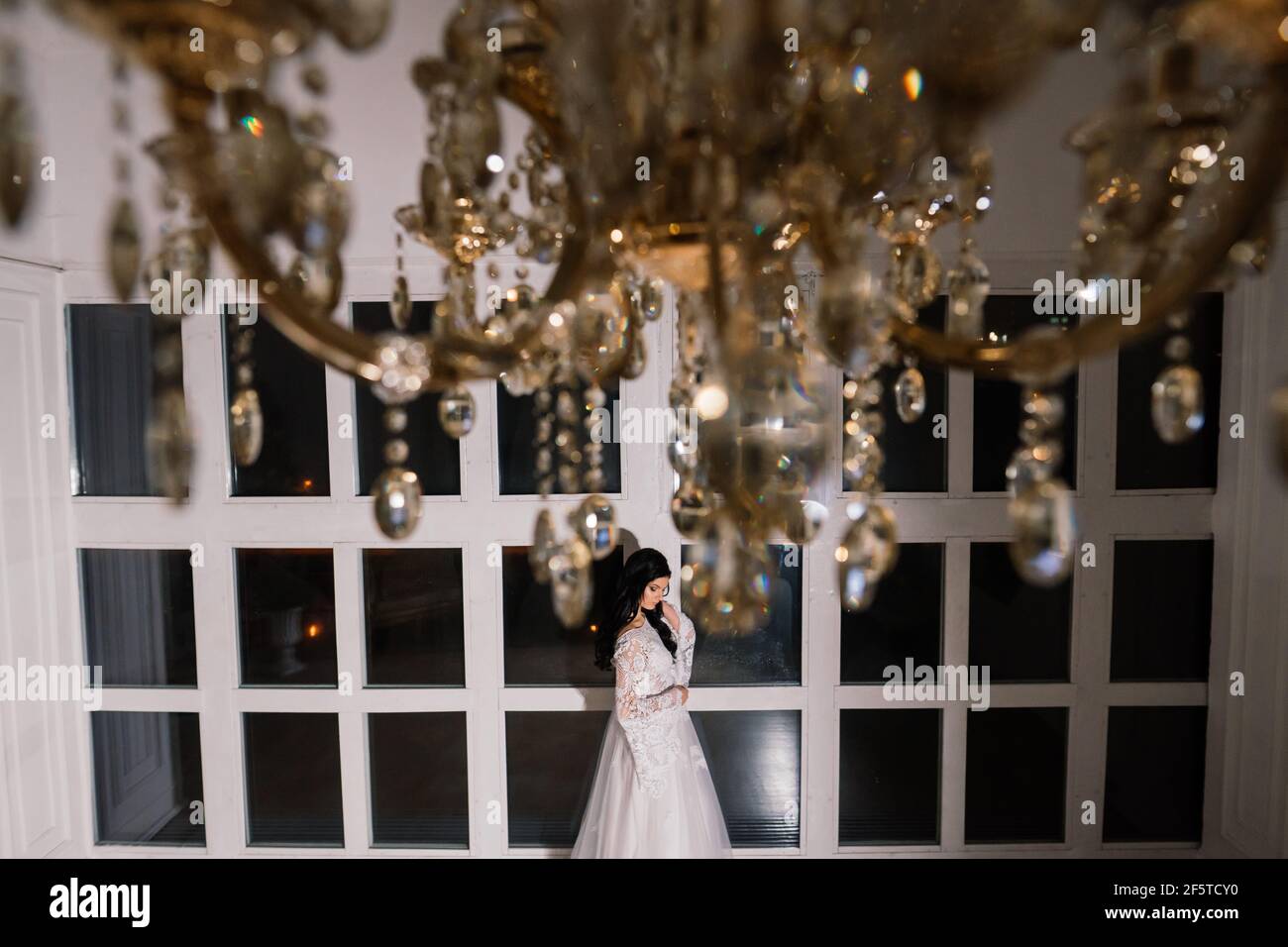 Bride on the background of new year lights, christmas interior Stock ...