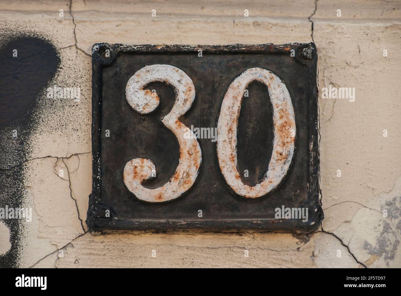 Old retro weathered cast iron plate with number 30 closeup Stock Photo ...